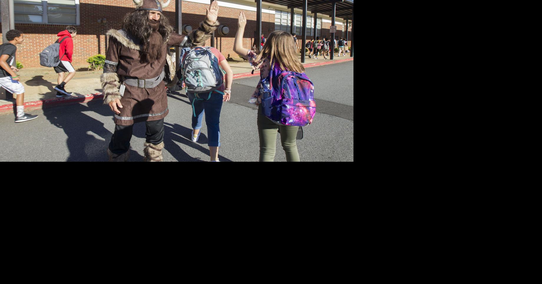 Kennesaw mayor Derek Easterling welcomes students dressed as a Viking ...