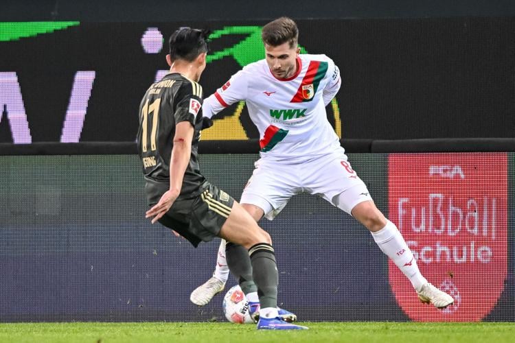 Union Berlin rescues a draw at Augsburg after fan protest interrupts ...