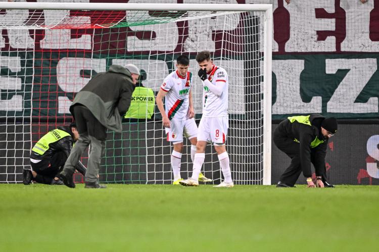 Union Berlin rescues a draw at Augsburg after fan protest interrupts ...