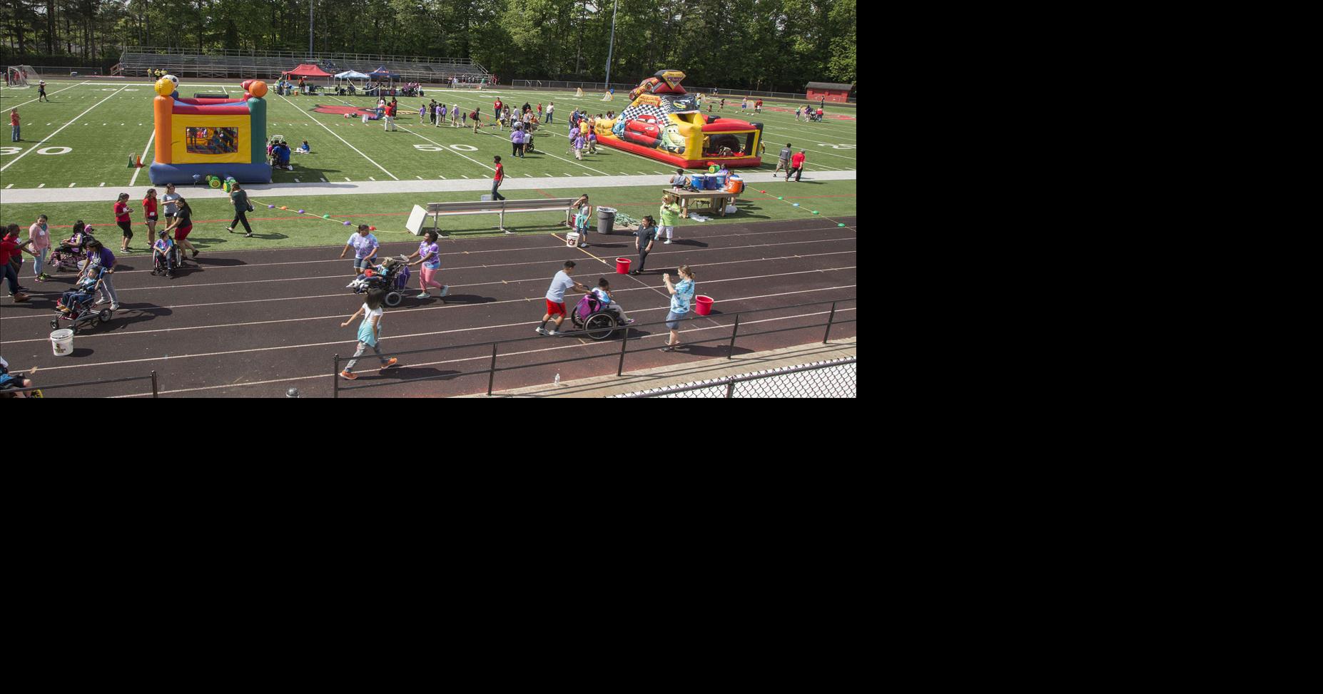 Elementary schoolers with special needs participate in first adapted P ...