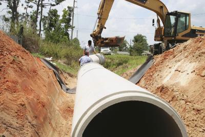 Sewer project suspended Spratt: county has authority to withdraw its ...
