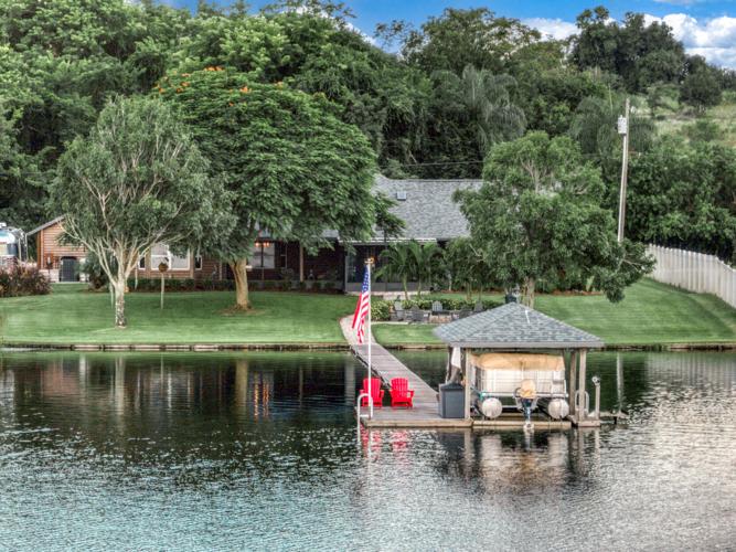 Log cabin on Lake Huntley | Highlands Homes | midfloridanewspapers.com