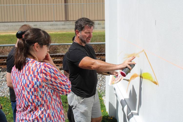 Spray and paint: Red Devil students take part in mural | News ...
