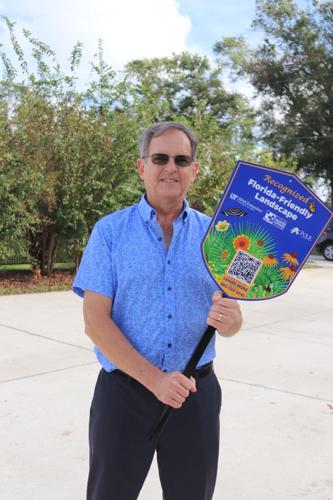 Dr. Butz recognized with silver certificate in landscape | Community ...