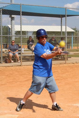 Softball players surprise local coach with award ...