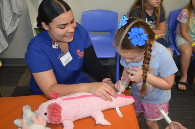 Nurses interact with children at Boo Boo Clinic | Highlands News-Sun ...