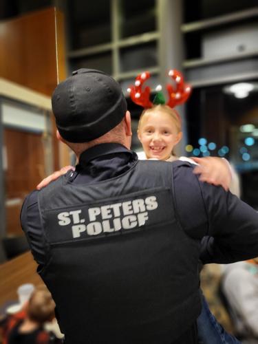 Local children help St. Peters Police get into the holiday spirit ...