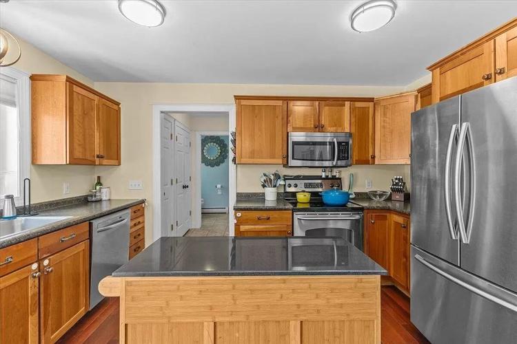 Home tour of the week: A chic $360,000 condo with mahogany wood floors ...