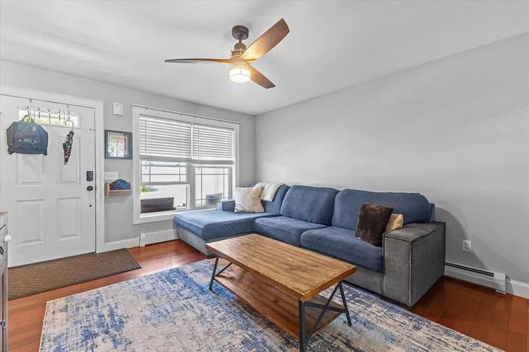 Home tour of the week: A chic $360,000 condo with mahogany wood floors ...