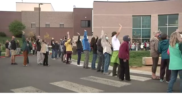 Hundreds of people gather outside Bozeman Health Deaconess Hospital ...