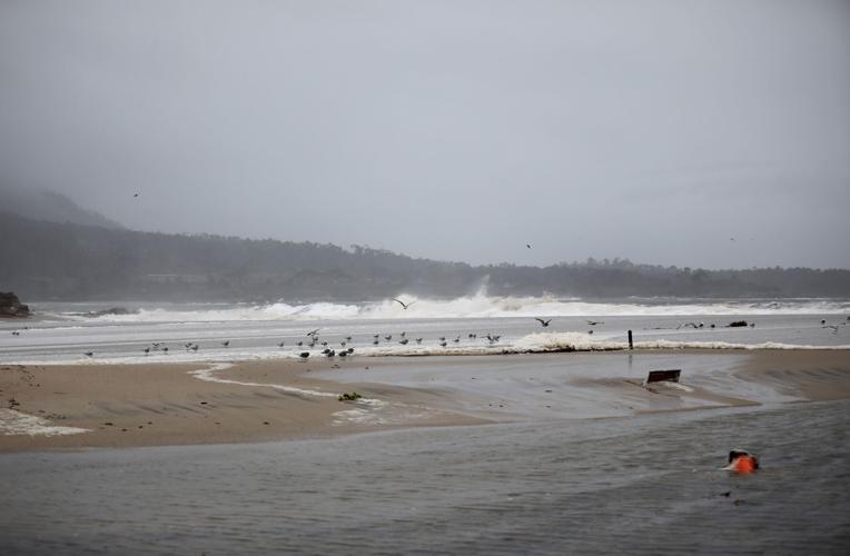 PHOTOS: A winter storm brings wind, rain and big waves to Monterey ...