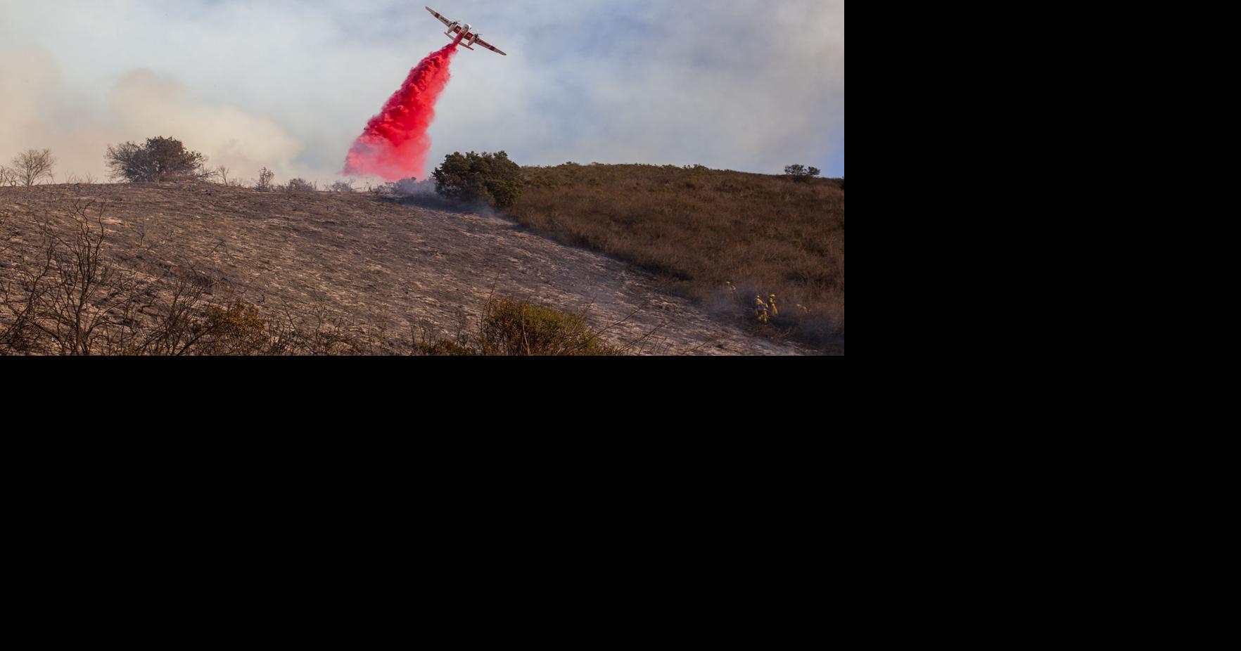 Firefighters battle a wildland blaze in the hills north of Salinas ...