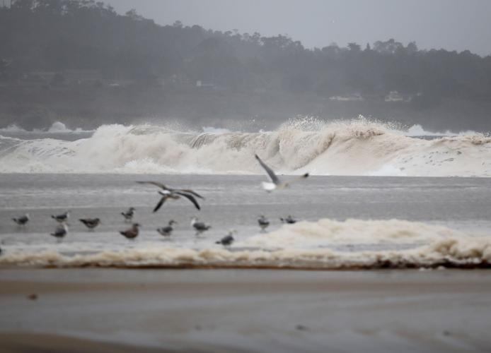 PHOTOS: A winter storm brings wind, rain and big waves to Monterey ...