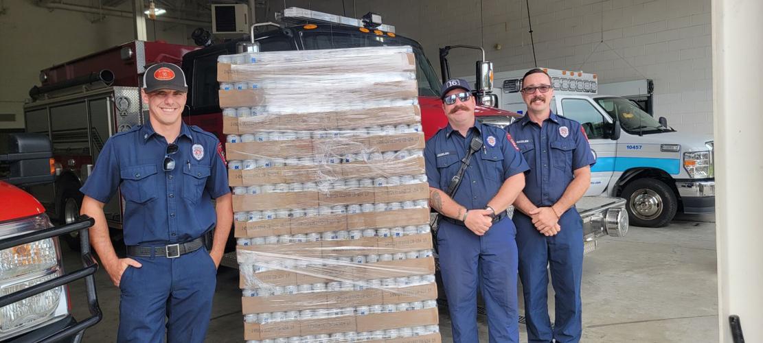Local firefighters receive drinking water donation | News ...