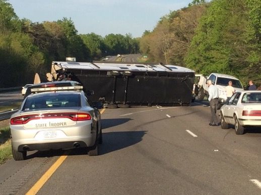 Overturned camper shuts down highway