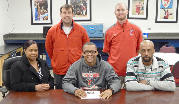 Freedom trio signs for football