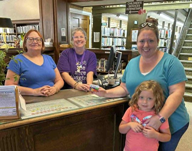 Local library card travels well; on display at a Long Island library ...