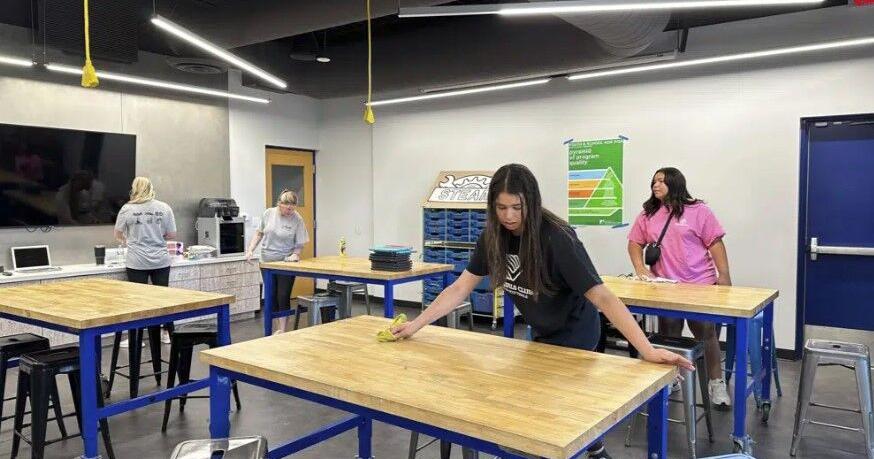 Addison Beer, 17, center, prepares for summer campers arriving next ...