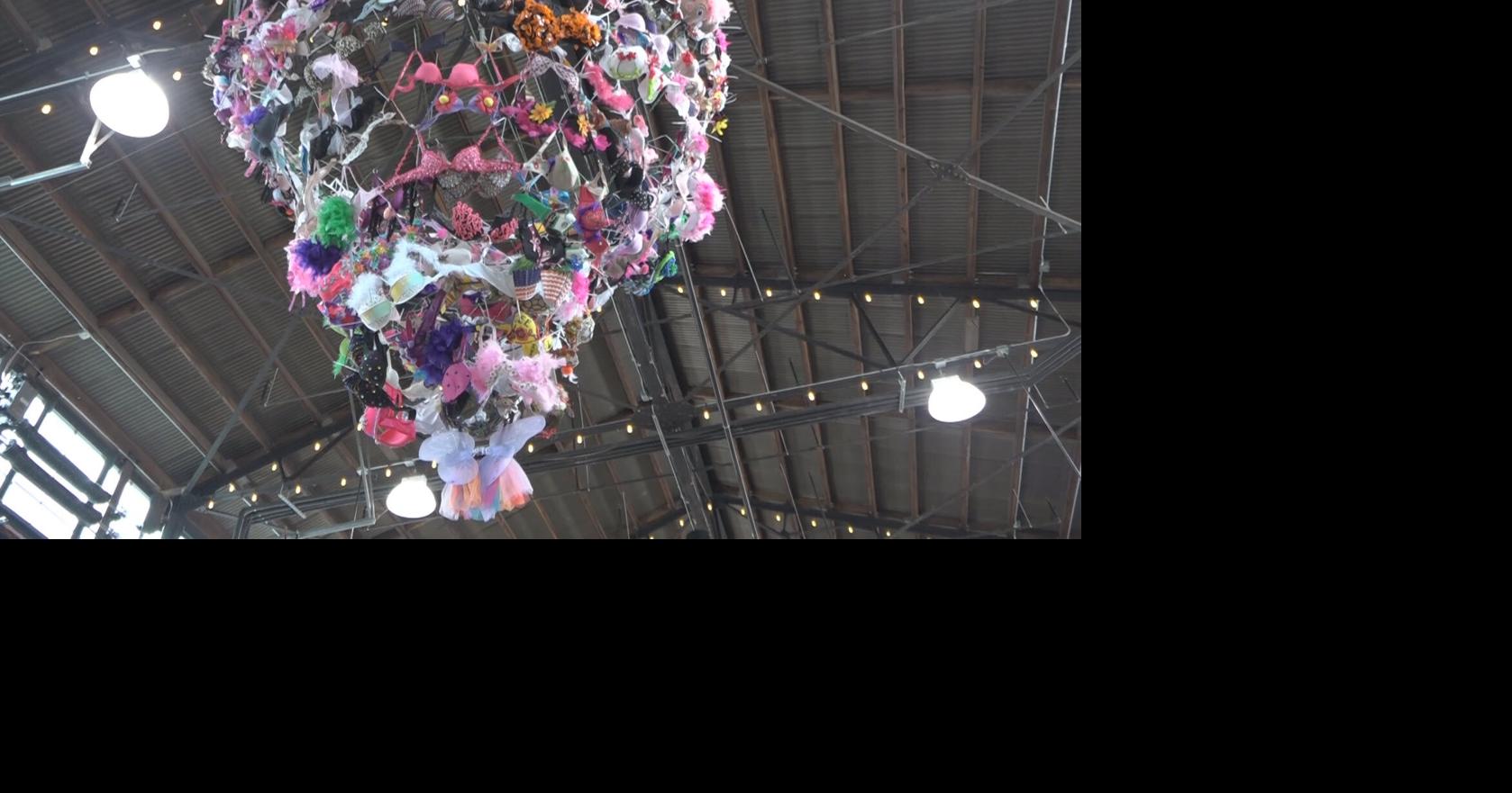 Pybus honors Breast Cancer Awareness Month with bra chandelier | Local ...