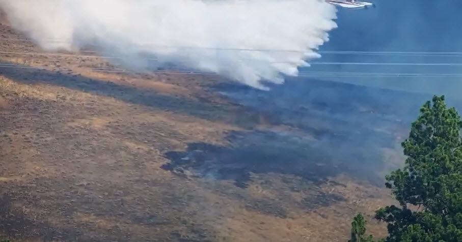 Attacking from four sides, firefighters significantly slow the growth ...