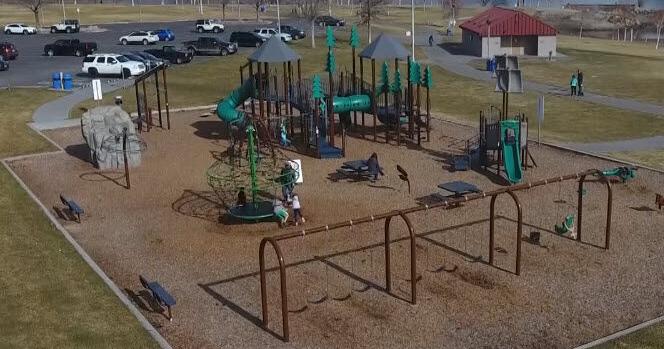 Kids using the Walla Walla Point playground for the first time in a ...