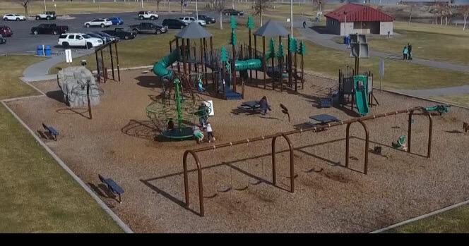 Kids using the Walla Walla Point playground for the first time in a ...