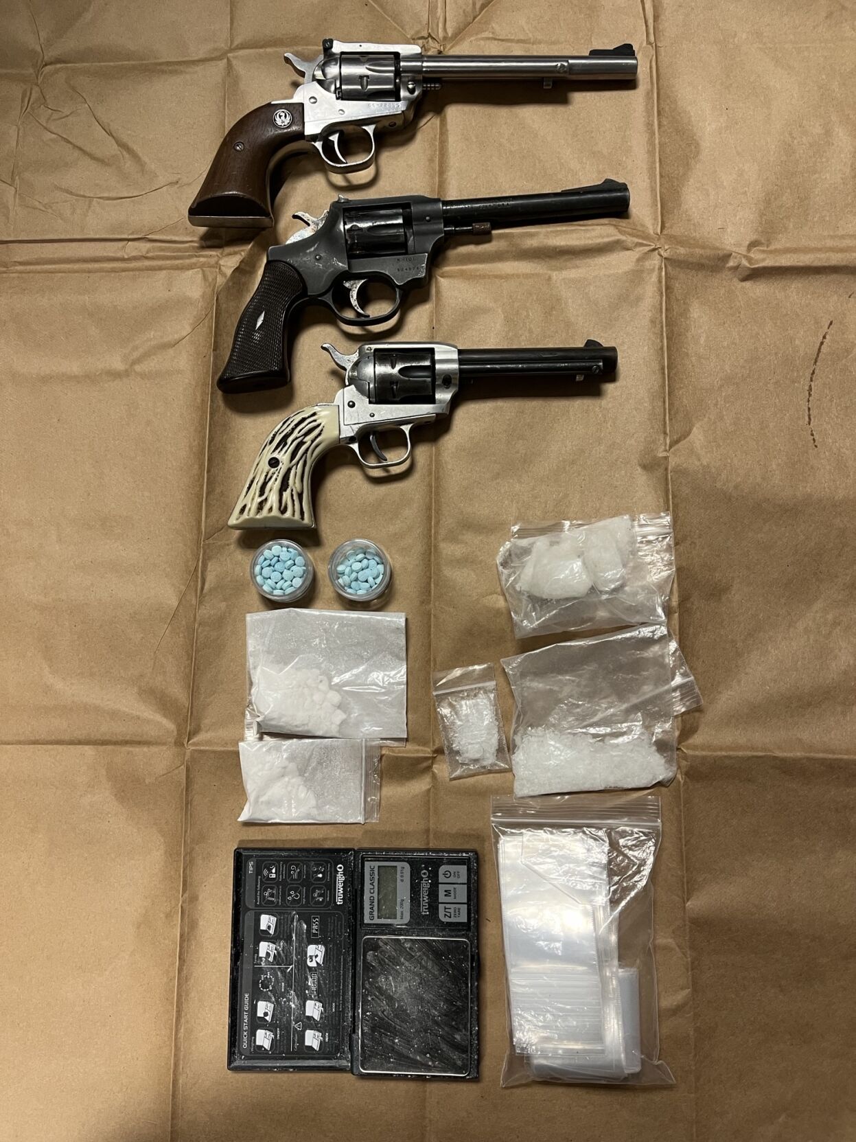 Police: Drug dog locates narcotics and weapons during warrant arrest ...