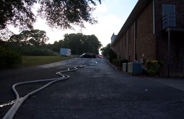 PHOTOS: Firefighters snuff smoky blaze at empty apartment building near ...