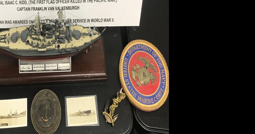 Superstructure pieces, sword from USS Arizona at Pearl Harbor display ...