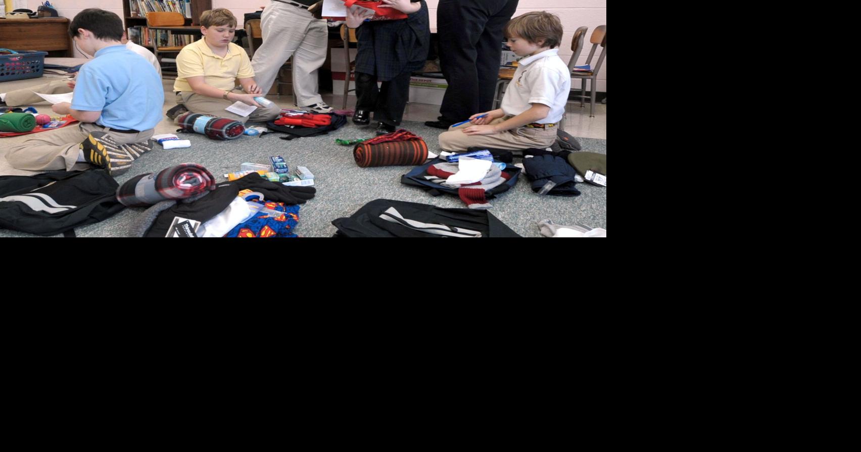 Holy Cross youths fill backpacks to be given this week to those in need ...