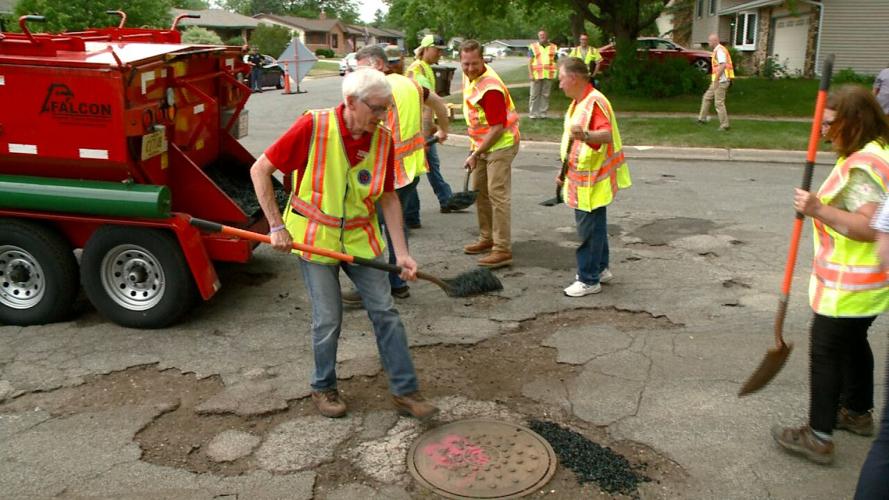 Gov. Evers picks up a shovel to help fill potholes, bring awareness to ...