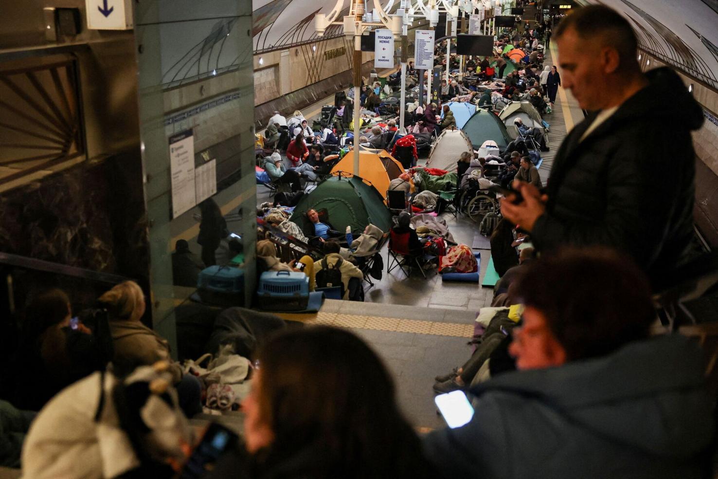 Kyiv hit by deadly Russian strikes, people feared trapped in apartment ...