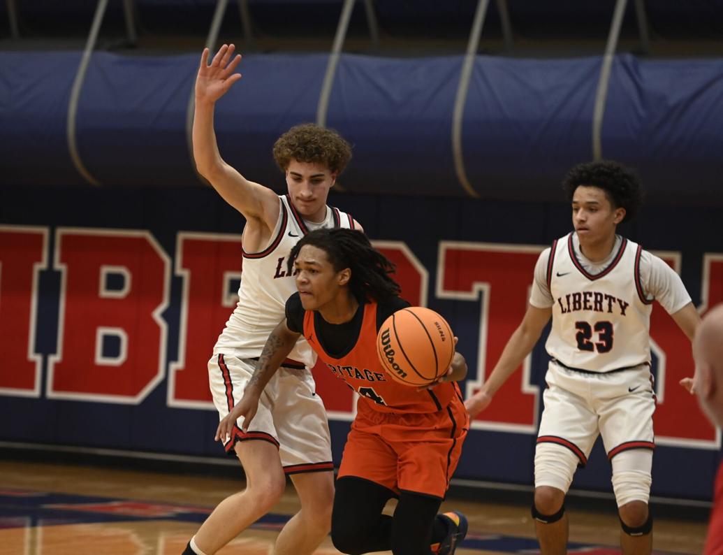 PHOTOS: Liberty High erases double-digit deficit to down Heritage
