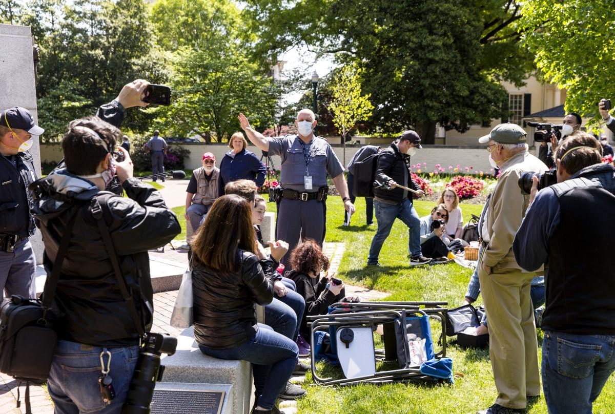 About 50 people gather at Capitol Square to protest Virginia's stay-at ...