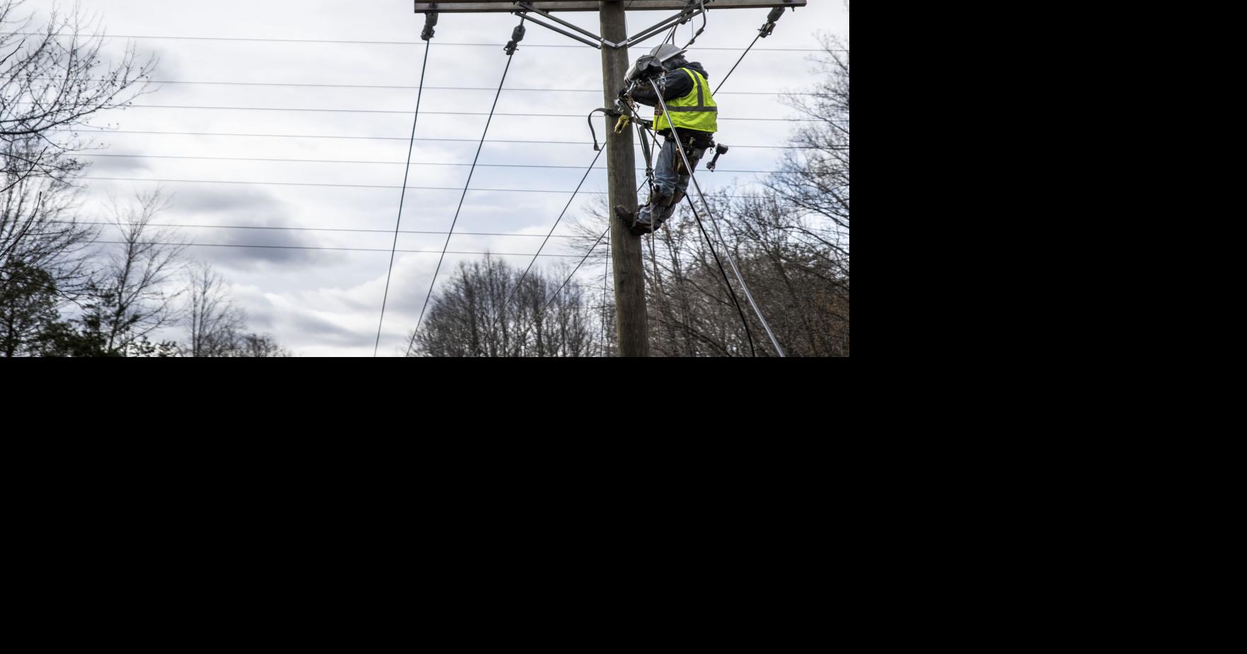 Crews work to install fiber-optic cable, allowing high-speed internet ...