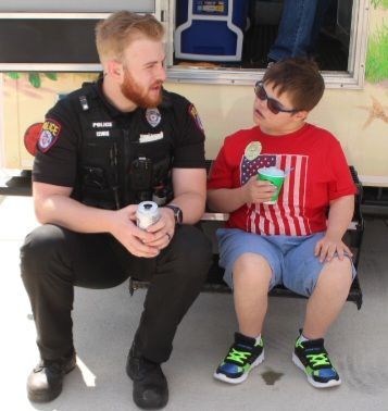 Liberty University police officer serves child