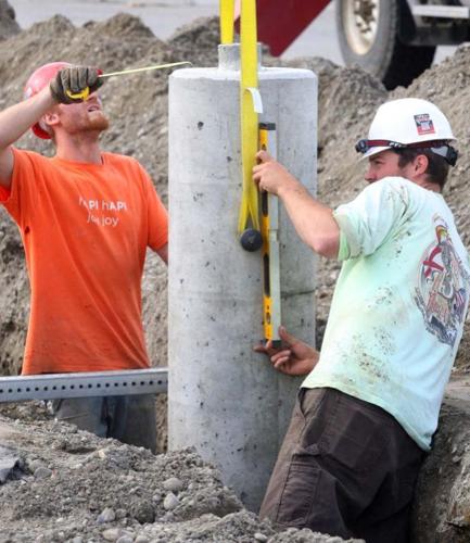 Crews installing outlets for car heaters in West Valley High School ...