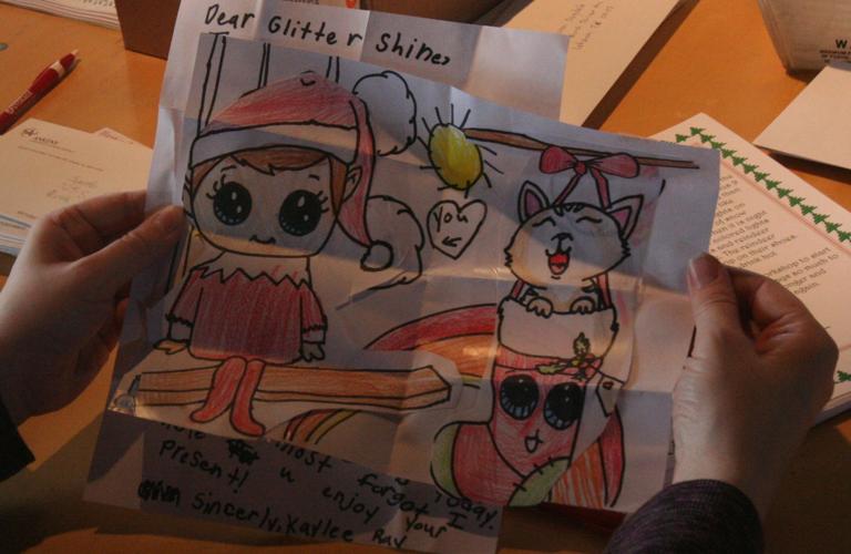 Volunteer elves dig into backlog of 10,000-plus letters to Santa Claus ...