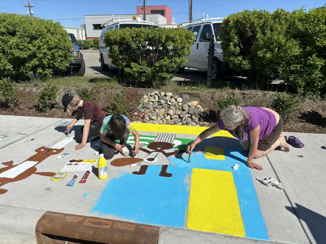 Artists paint downtown storm drains | Local News | newsminer.com