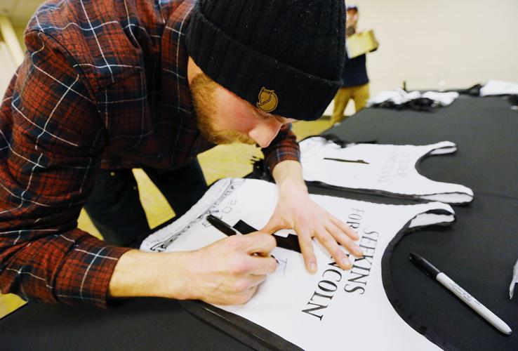 Rookie Tim Pappas picks bib No. 1 at the Yukon Quest Start and Draw ...