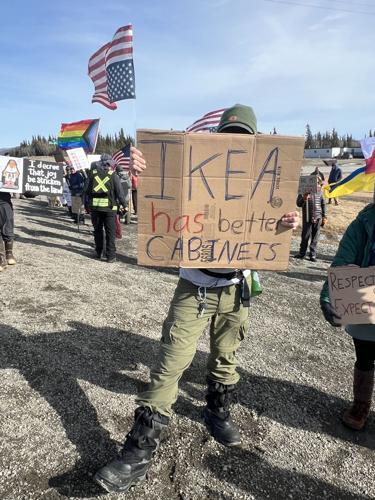 Colorful flags, penguins and protest signs fill Healy in 'Hands Off ...