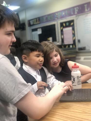 North Pole high schoolers share a love of coding with younger students ...