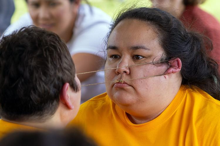 Father-son duo win ear pull, women’s finalists battle amid bloody ears ...