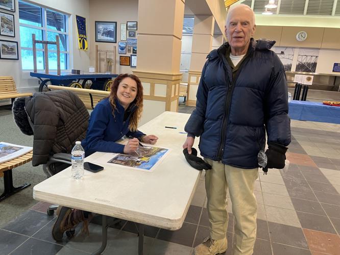 Train conductor/artist Riana Sather signs historic AKRR print | Kris ...