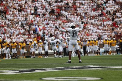 Cincinnati defeats Towson in scorching season opener | Football ...