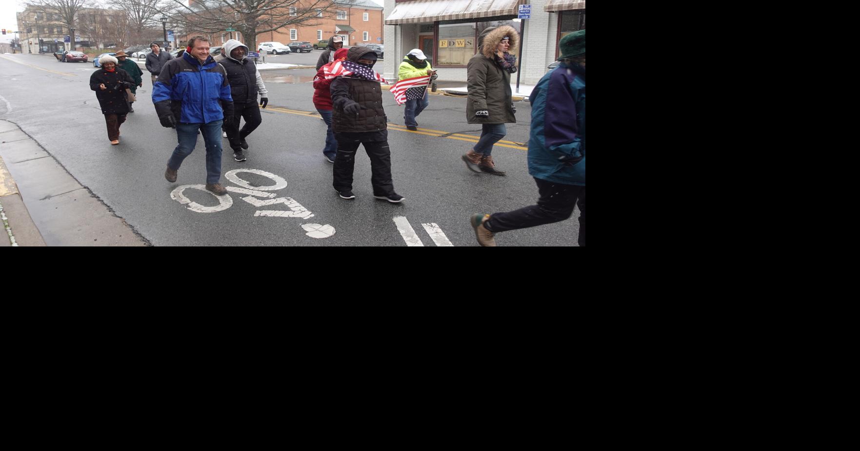 Marchers brave cold, snow to honor legacy of MLK