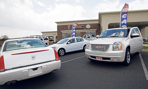 Car dealer gets reinstated with Cadillac, GMC trucks