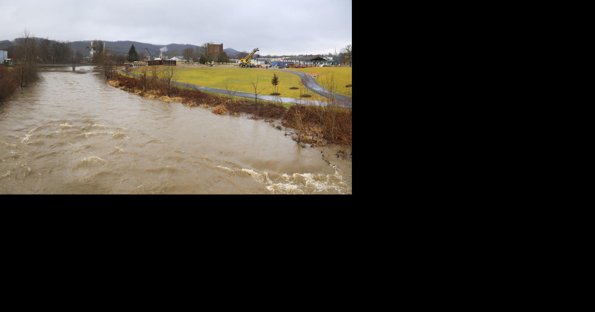 Rain-swollen river rises, but no flooding feared