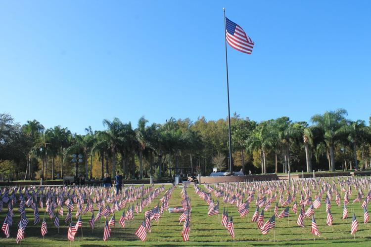 PHOTOS: Honoring our veterans: Planting American flags into Memory Mall ...