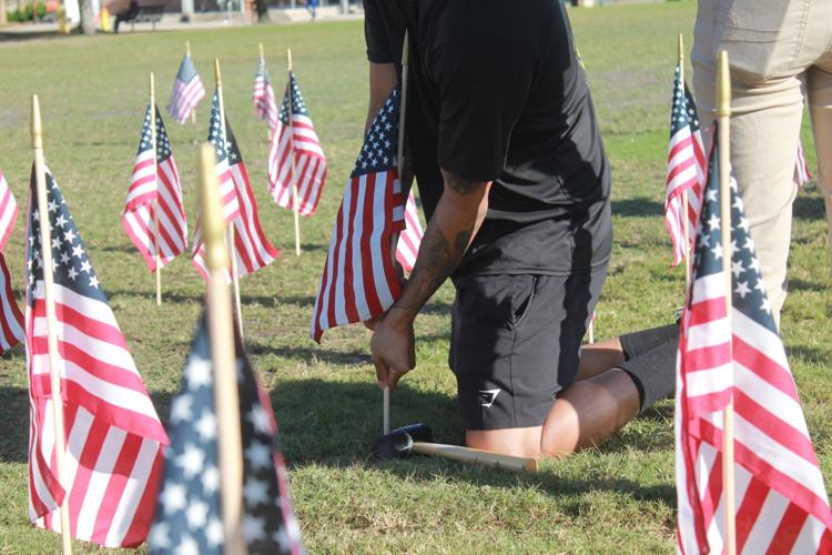 PHOTOS: Honoring our veterans: Planting American flags into Memory Mall ...